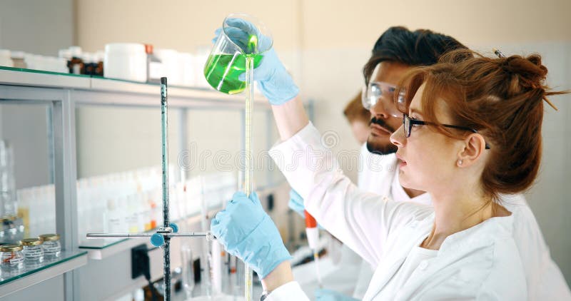 Group of Chemistry Students Working in Laboratory Stock Photo - Image ...