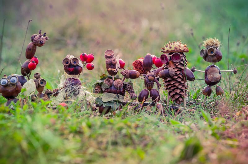 Group of Chestnut Figures in Grass Stock Image - Image of artwork ...