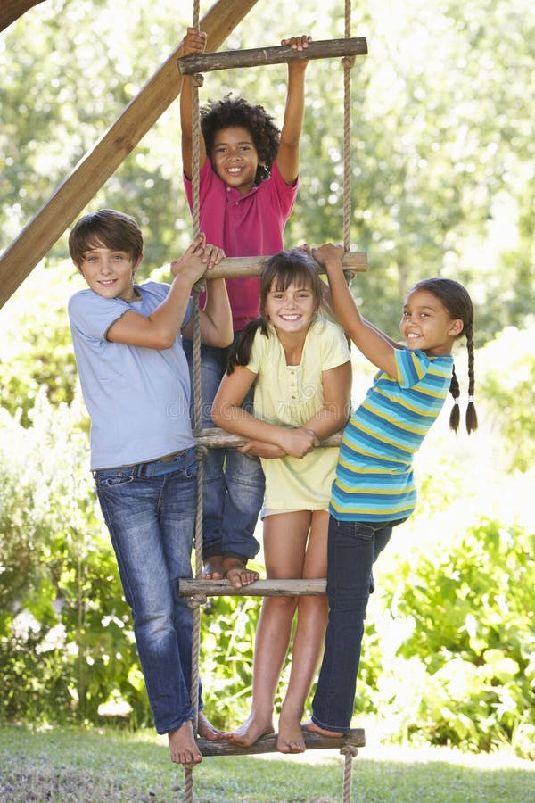Group of Children Climbing Rope Ladder To Treehouse Stock Photo - Image ...