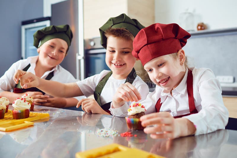 A Group of Children are Cooking in the Kitchen. Stock Photo - Image of ...