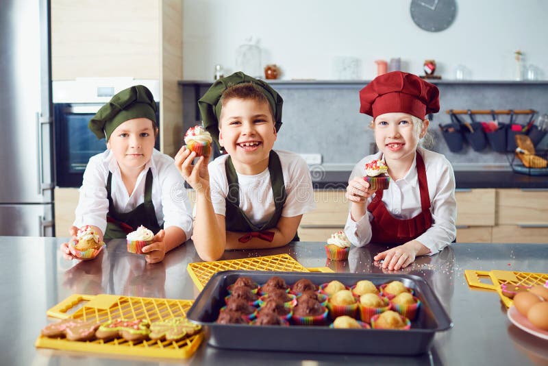 A Group of Children are Cooking in the Kitchen. Stock Image - Image of ...