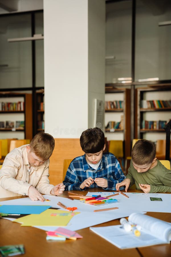 Group of Children Drawing during Art Lesson in Library Stock Image ...