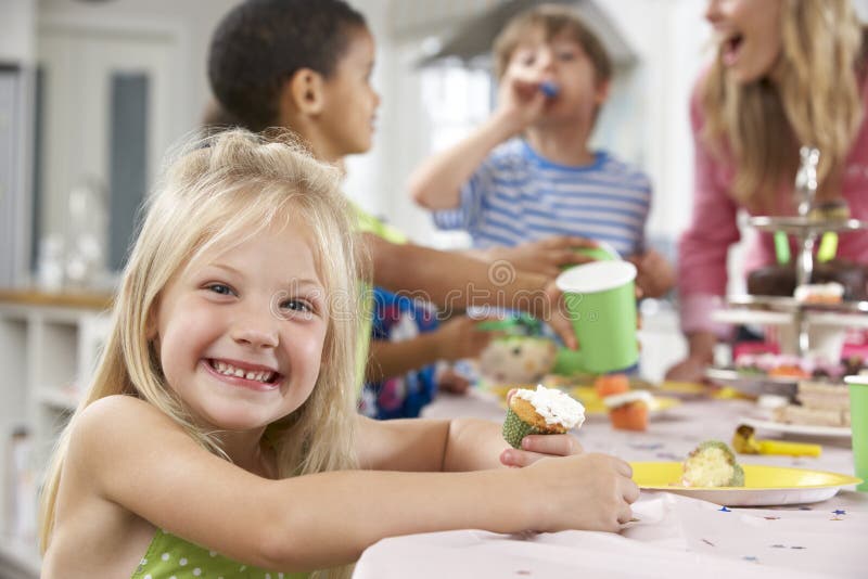 Group of Children Enjoying Birthday Party Food at Table Stock Image ...