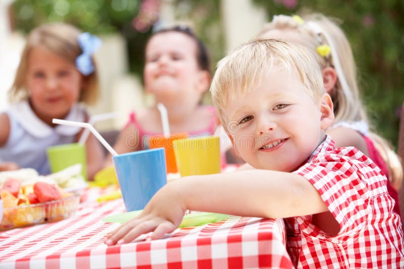 Group Of Children Enjoying Outdoor Tea Party Stock Photo - Image of ...