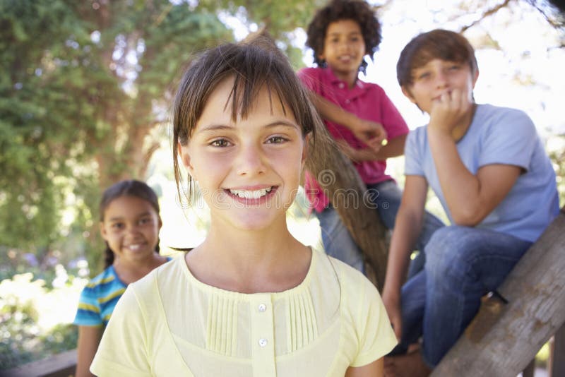 Group of Children Hanging Out in Treehouse Together Stock Image - Image ...