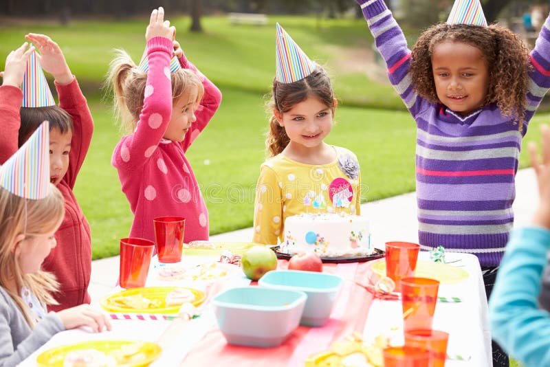 Group of Children Having Outdoor Birthday Party Stock Photo - Image of ...