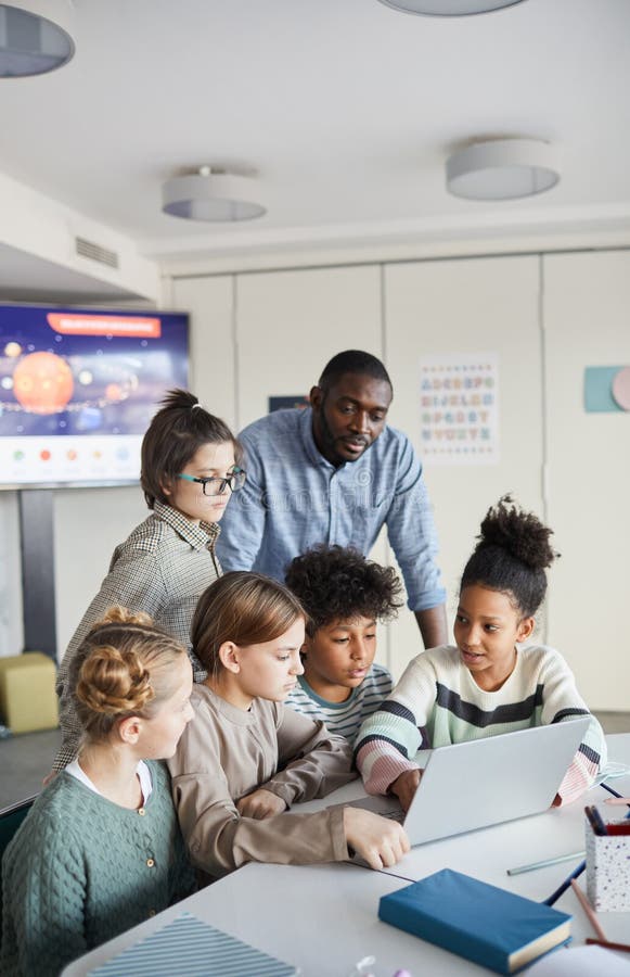 Group of Children Looking at Computer Screen in School Stock Photo ...