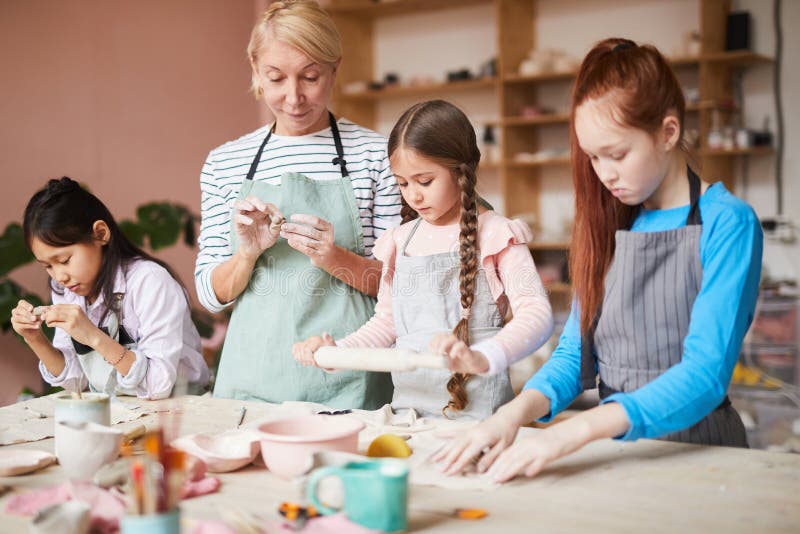 Pottery Class for Children stock image. Image of ceramist - 141672381