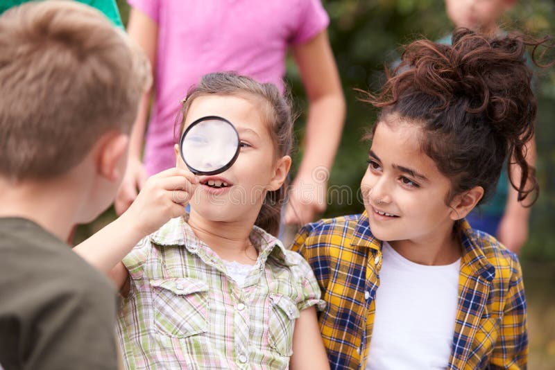 Group of Children on Outdoor Activity Camping Trip Looking at Map ...