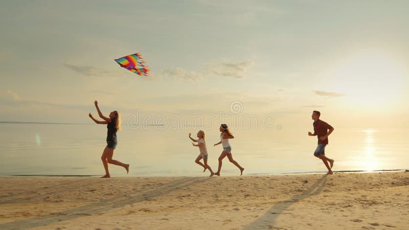 Two Children Playing with a Puppy in the Backyard of the House Stock ...