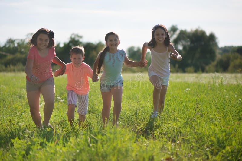 Group of Children Playing on Grass Stock Photo - Image of healthy ...