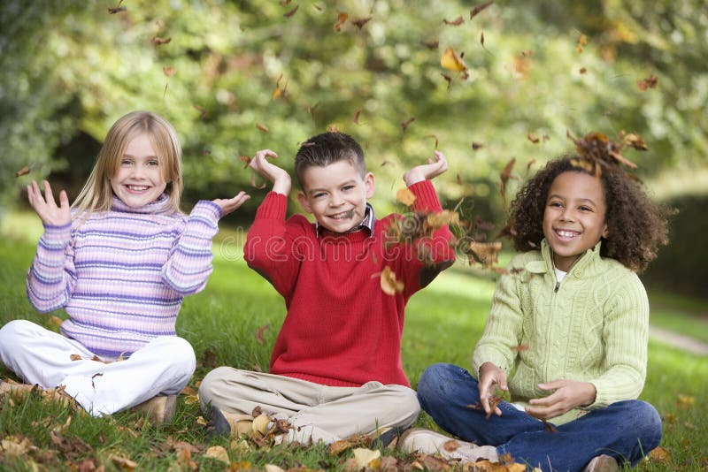 Group of Children Playing in Leaves Stock Image - Image of happy ...