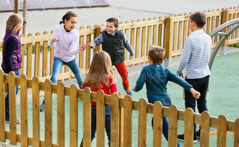 Group of Children Playing Romp Game Touch-last Outdoors Stock Photo ...