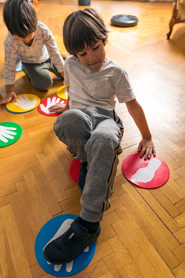Boys Jumping Over Ladders stock photo. Image of child - 211216788