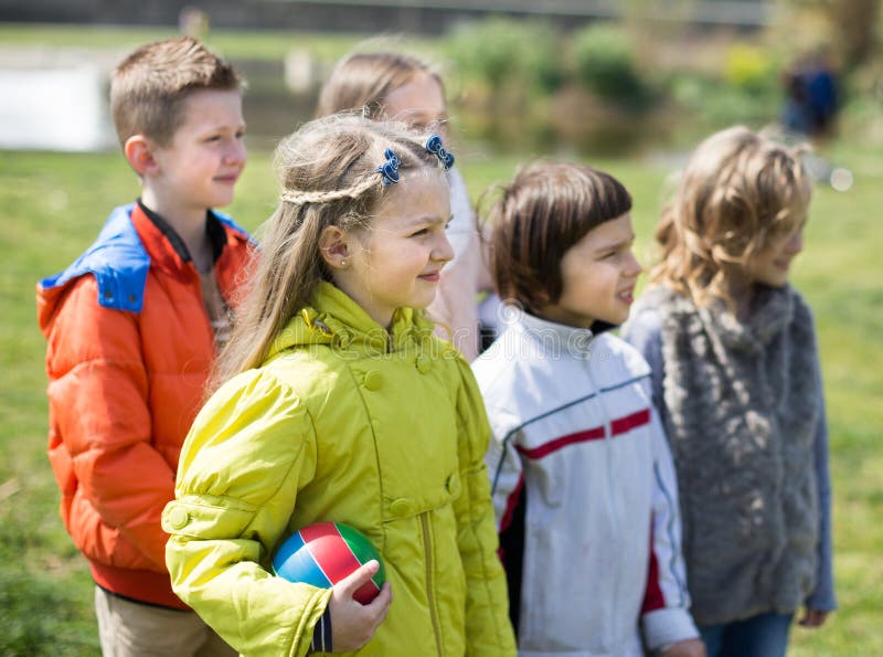Group of Children Posing in Park in Spring Stock Photo - Image of ...