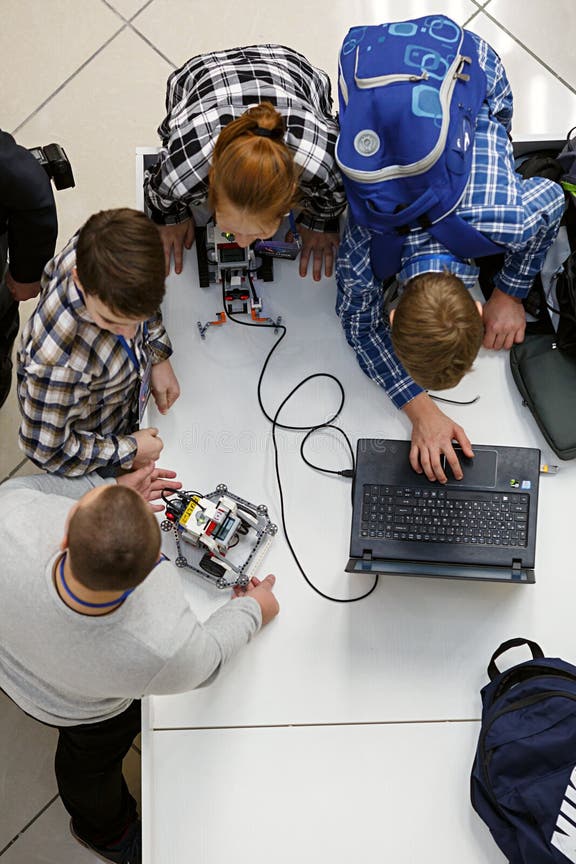 Group of Children Programming the Robot at Robotics Competitions ...