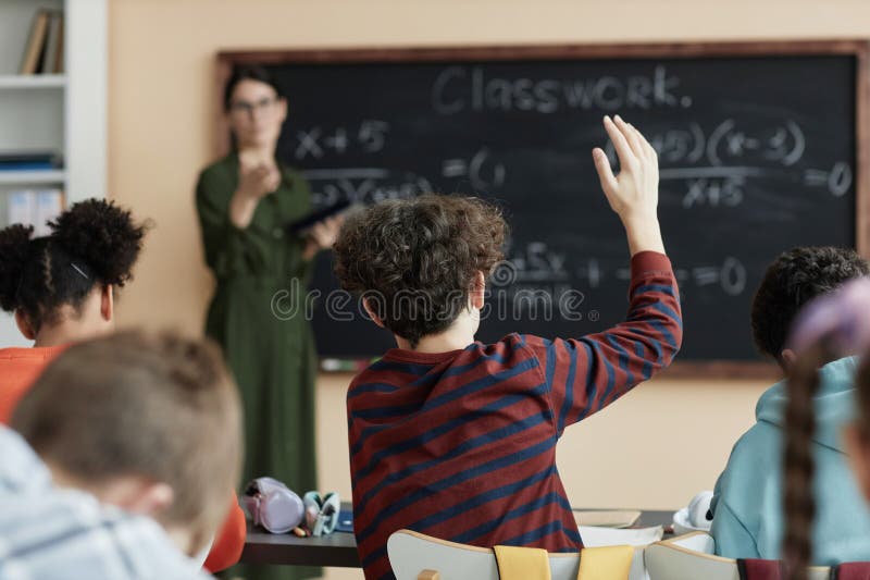Group of Children Raising Hands in School Stock Image - Image of ...