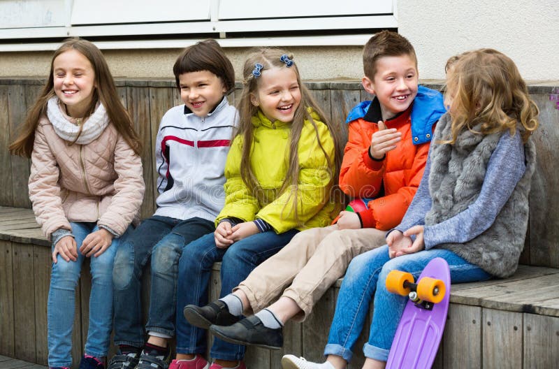 Group of Children Sitting on Bench Stock Image - Image of hobby ...
