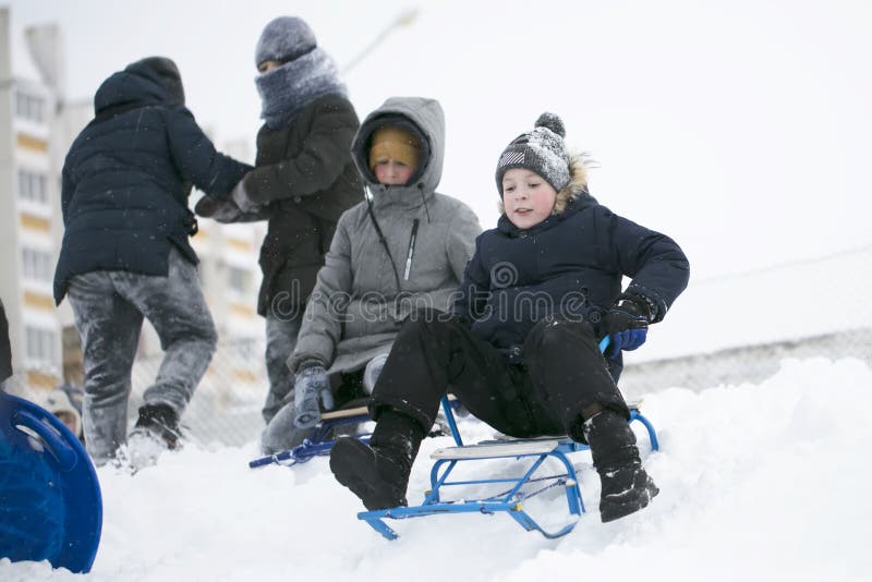 A Group of Children Sledding Stock Image - Image of outdoor, active ...