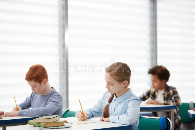 Group of Children Writing in Class Stock Image - Image of people ...