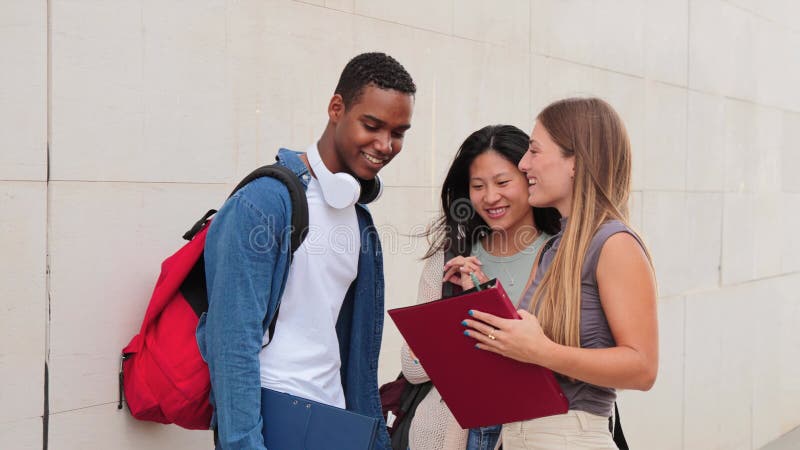 Four Teenage Real Students Walking, Smiling and Talking Together at ...
