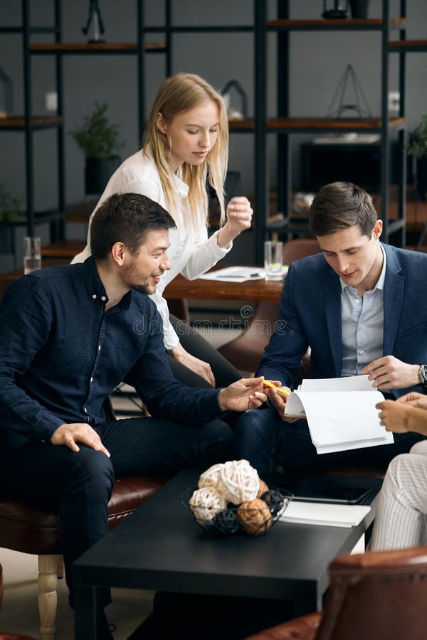 Group of Clever Business People Reading a Document Stock Photo - Image ...