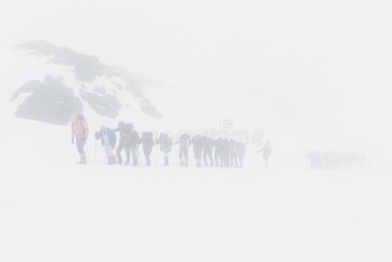 Group of Climbers Climbing Snowy Mountain Peaks in Dense Fog Stock ... Group of Climbers Climbing Snowy Mountain Peaks in Dense Fog Stock ...