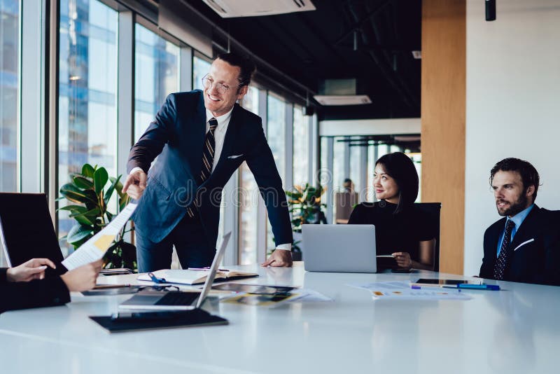 Group of Colleagues Collaborating in Office Interior Stock Photo ...