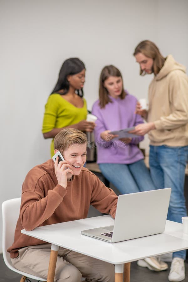 A Group of Colleagues Discussing Something and Looking Involved Stock ...
