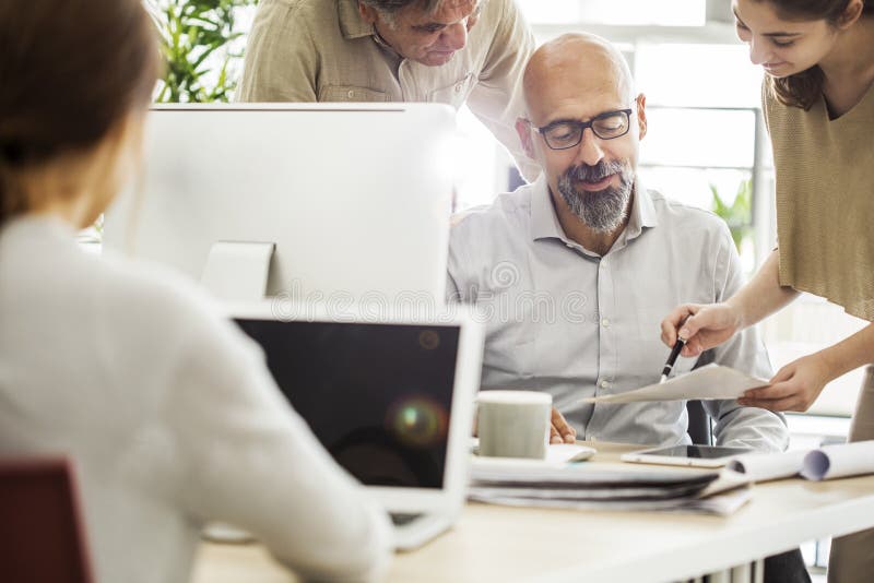 Group of Colleagues Talking Around a Table Stock Photo - Image of ...