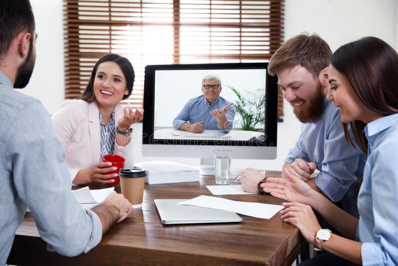 Colleagues Using Video Chat for Online Job Interview in Office Stock ...