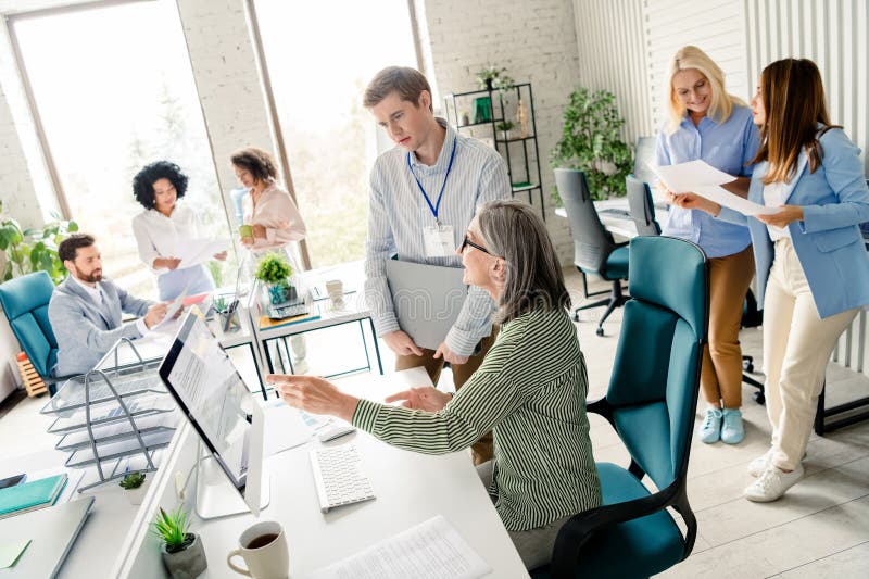 Diverse Team Collaborating in a Modern Office Environment with ...