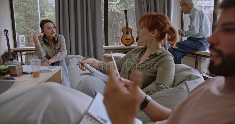 Group of College Students are Learning Together in a Relaxed and ...