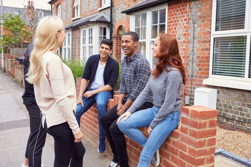 Group of College Students Outside Rented Shared House Talking and ...