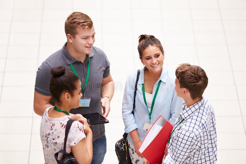 Group of College Students Standing in Hallway Talking Stock Photo ...