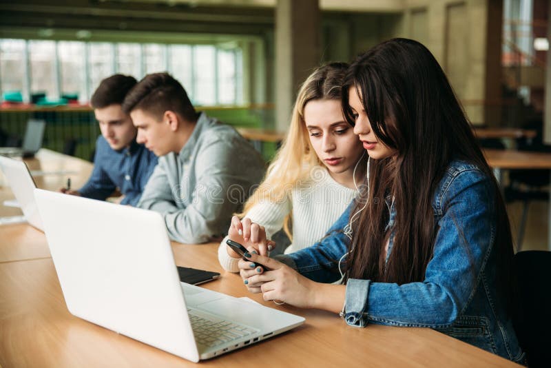 Group of College Students Studying in the School Library, a Girl and a ...