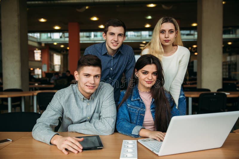 Group of College Students Studying in the School Library, a Girl and a ...