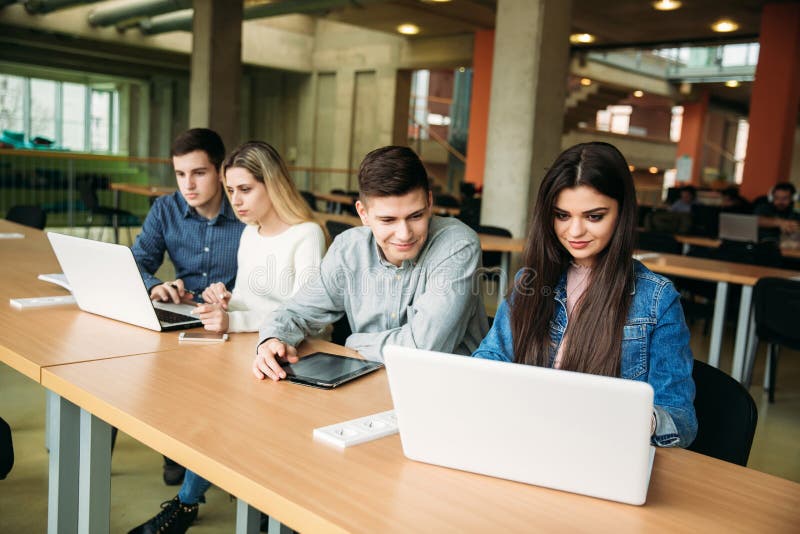 Group of College Students Studying in the School Library, a Girl and a ...