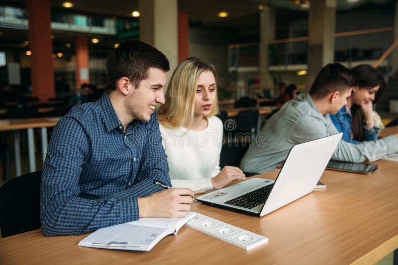 Group of College Students Studying in the School Library, a Girl and a ...