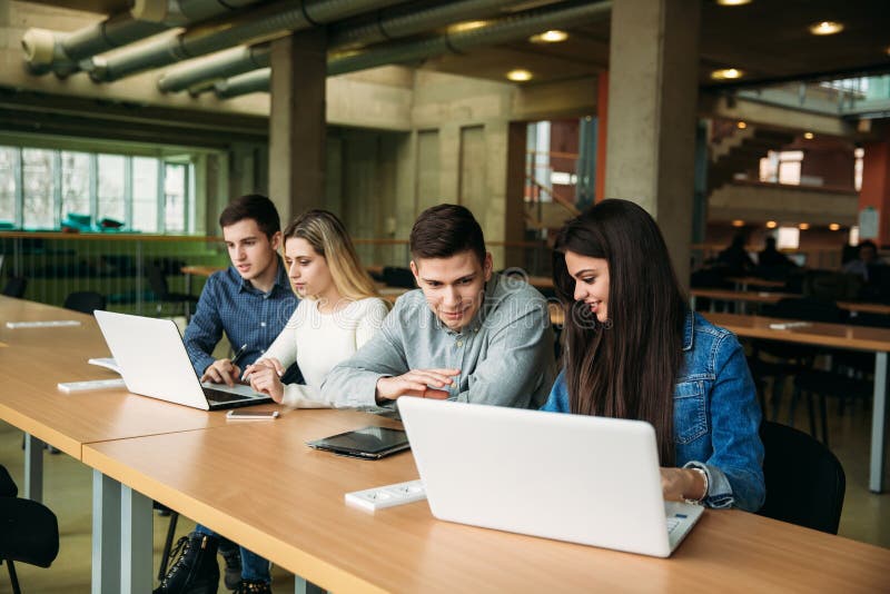 Group of College Students Studying in the School Library, a Girl and a ...