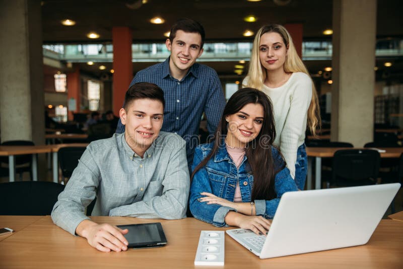 Group of College Students Studying in the School Library, a Girl and a ...