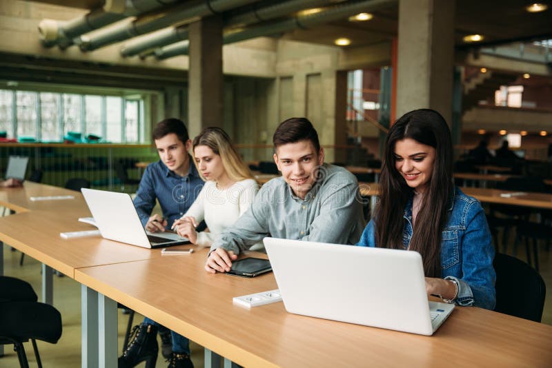 Group of College Students Studying in the School Library, a Girl and a ...