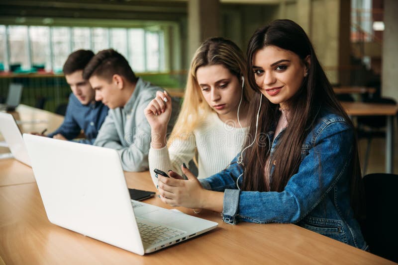 Group of College Students Studying in the School Library, a Girl and a ...
