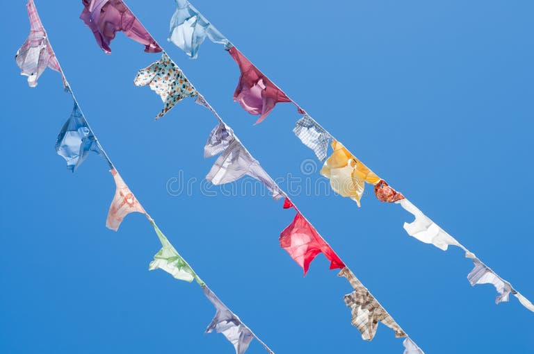 A Group of Colored Shirts on a Clothesline Stock Image - Image of ...