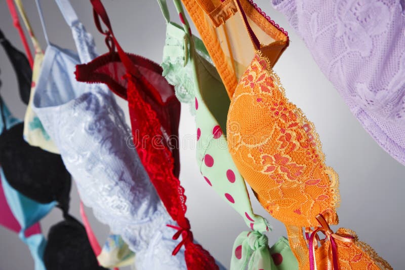 Numerous Colorful Bras are Hung on a Close Line in a Studio Environment ...