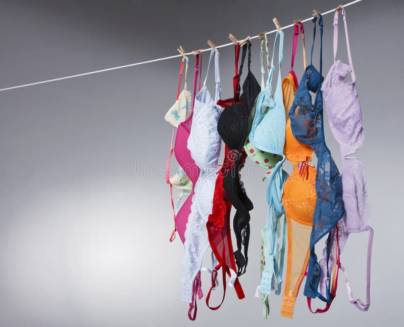 Numerous Colorful Bras are Hung on a Close Line in a Studio Environment ...