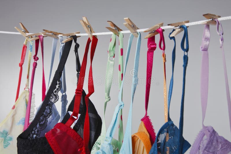 Numerous Colorful Bras are Hung on a Close Line in a Studio Environment ...