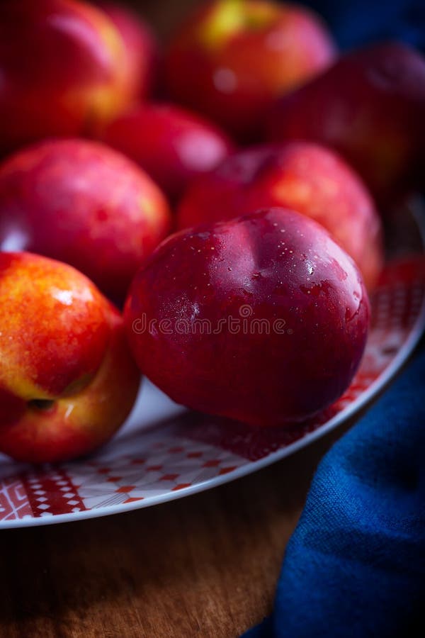 A Group of Colorful Nectarine Fruits or Peach on a Plate Stock Image ...