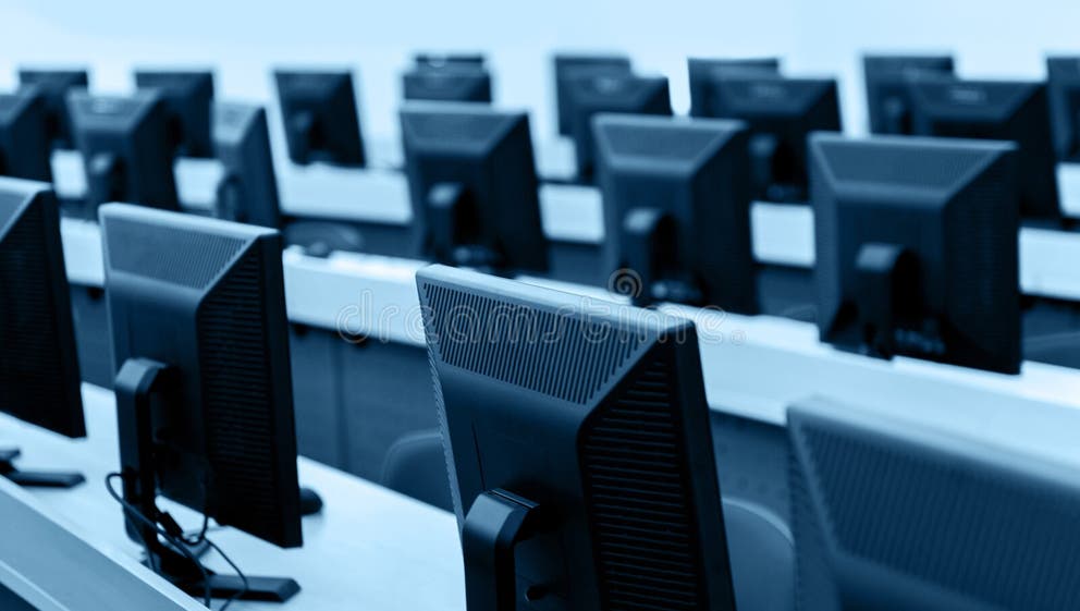 Computers in computer lab stock image. Image of dark - 284477745