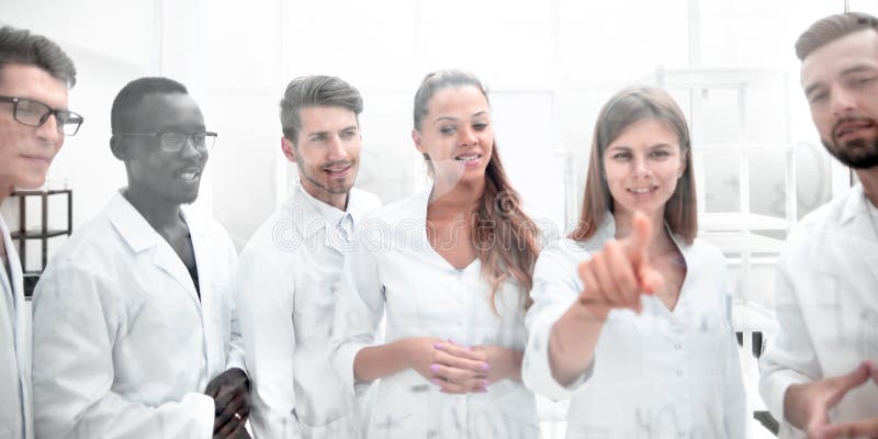 Group of Laboratory Scientists Discussing Their Research in the ...